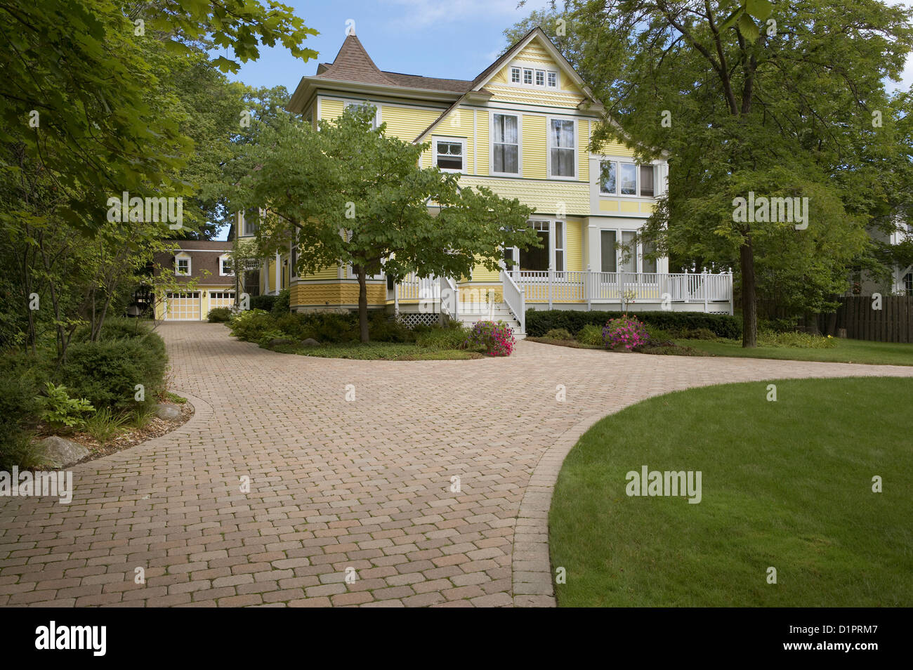 EXTERIORS Yellow clapboard Victorian with white trim curved cobblestone ...