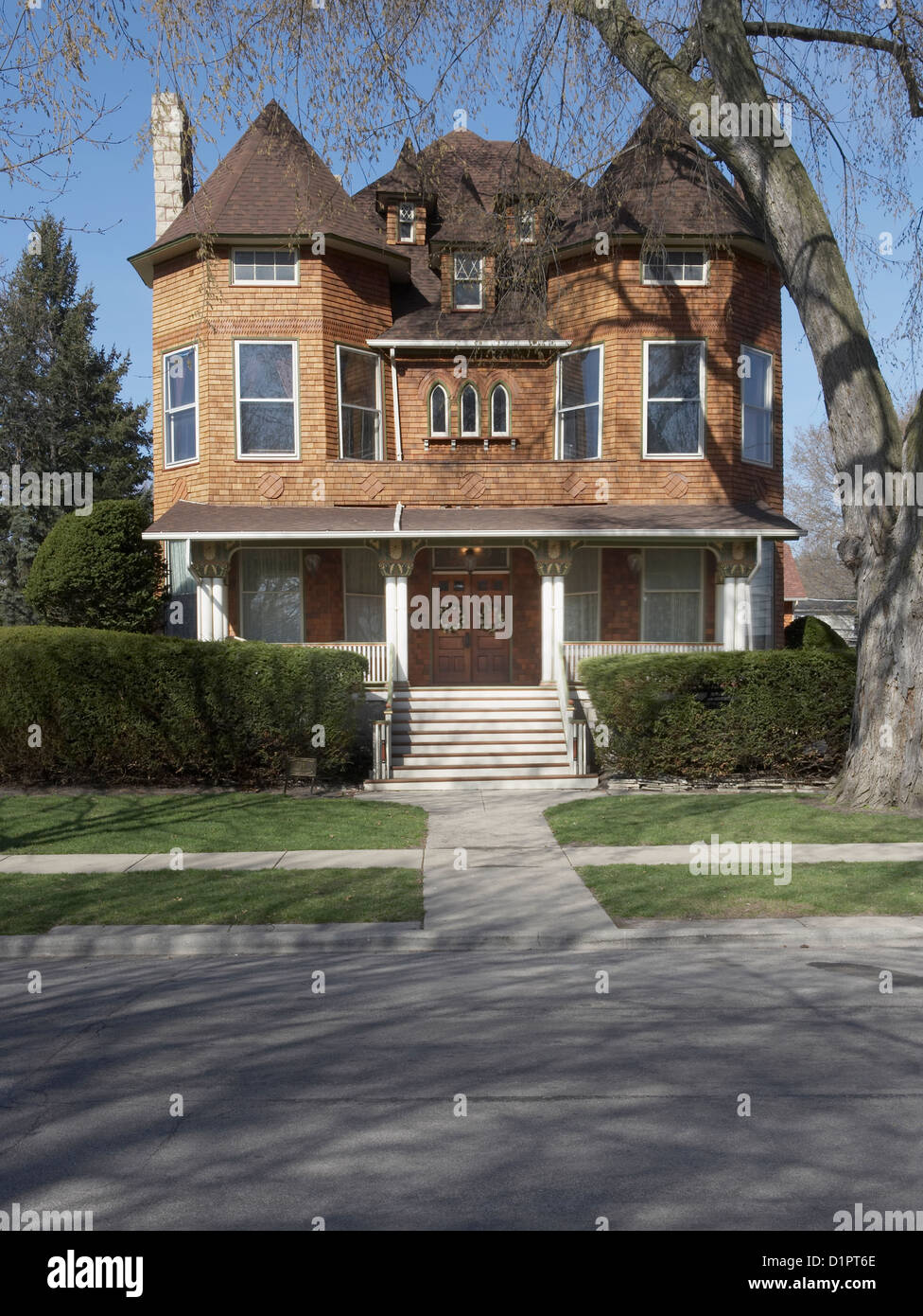 EXTERIORS: Cedar shake three story home, with gothic windows, and three ...