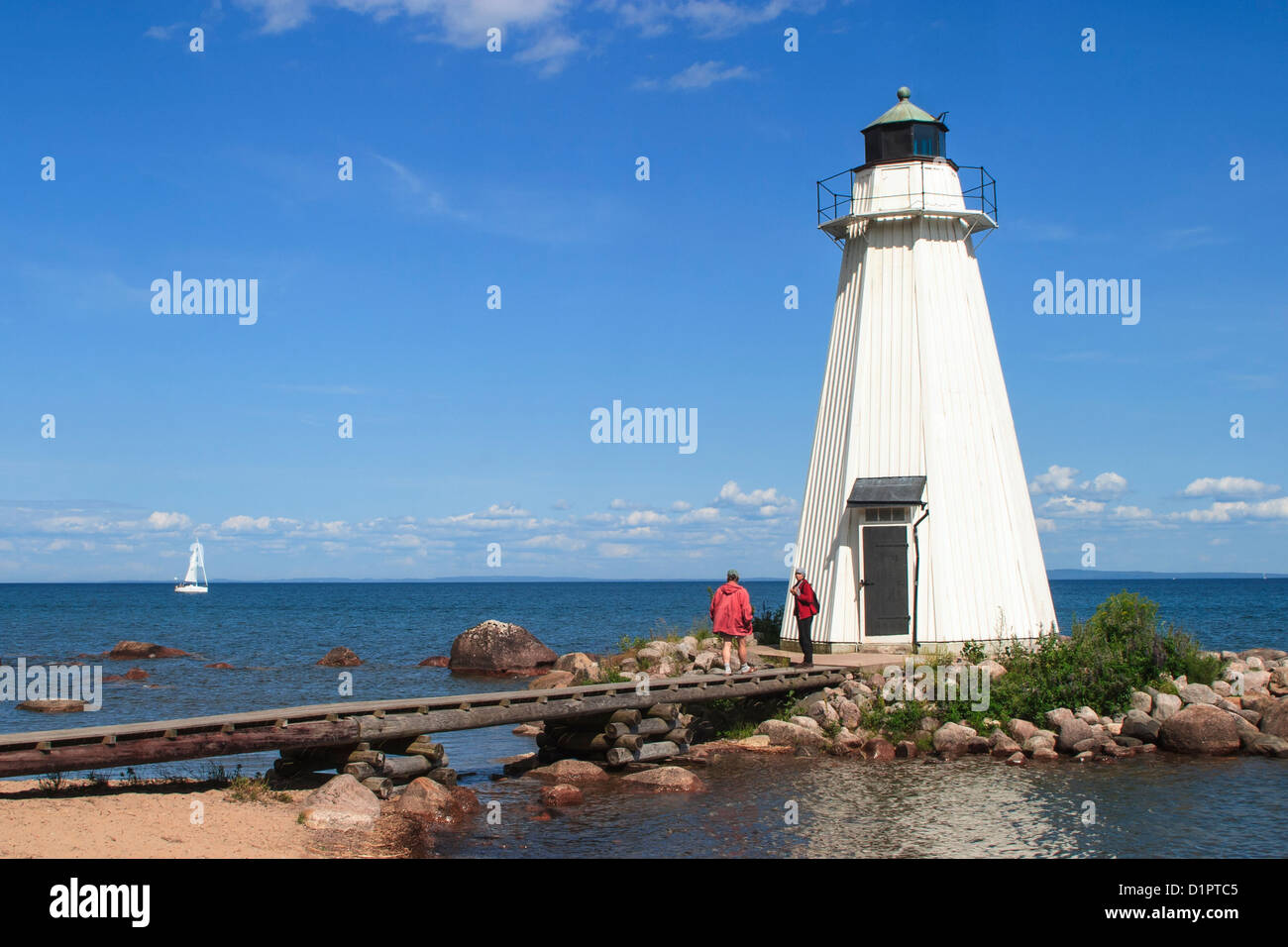 Wooden lighthouse by the lake Stock Photo - Alamy