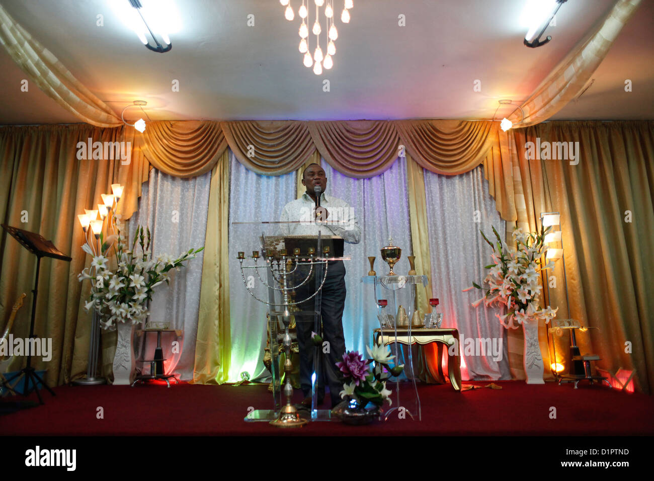 An African pastor preaching in a church of migrants in Neve Shaanan ...