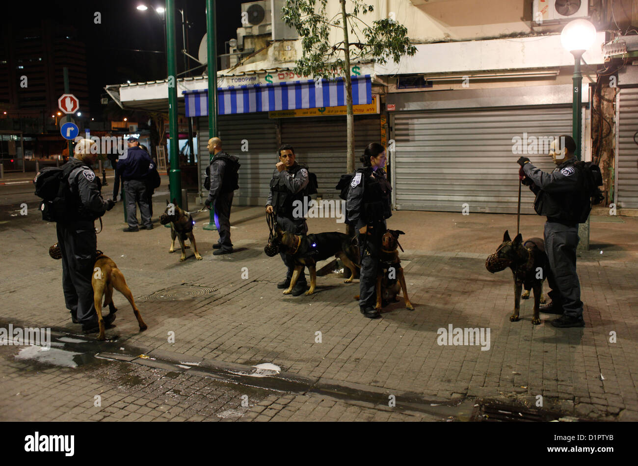 Armed Police dog handlers patrolling in Neve Shaanan neighborhood which ...