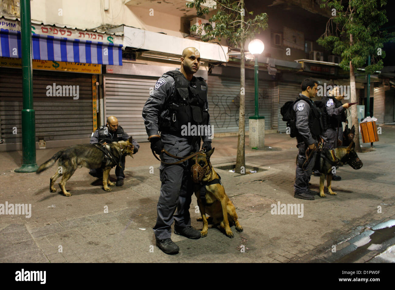 Armed Police dog handlers patrolling in Neve Shaanan neighborhood which ...