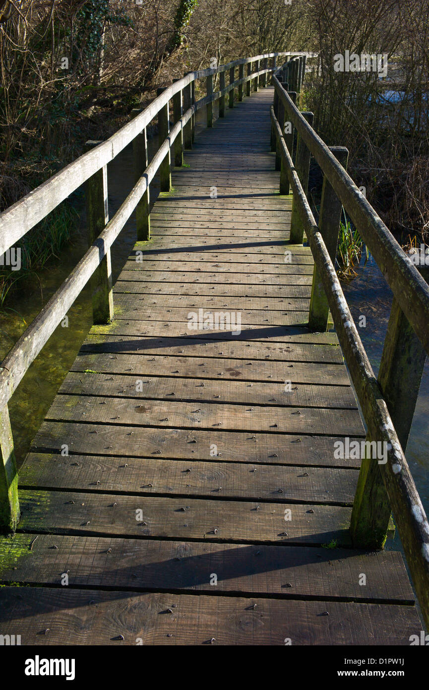 Wooden footbridge across the River Test, Wherwell, Hampshire, England ...