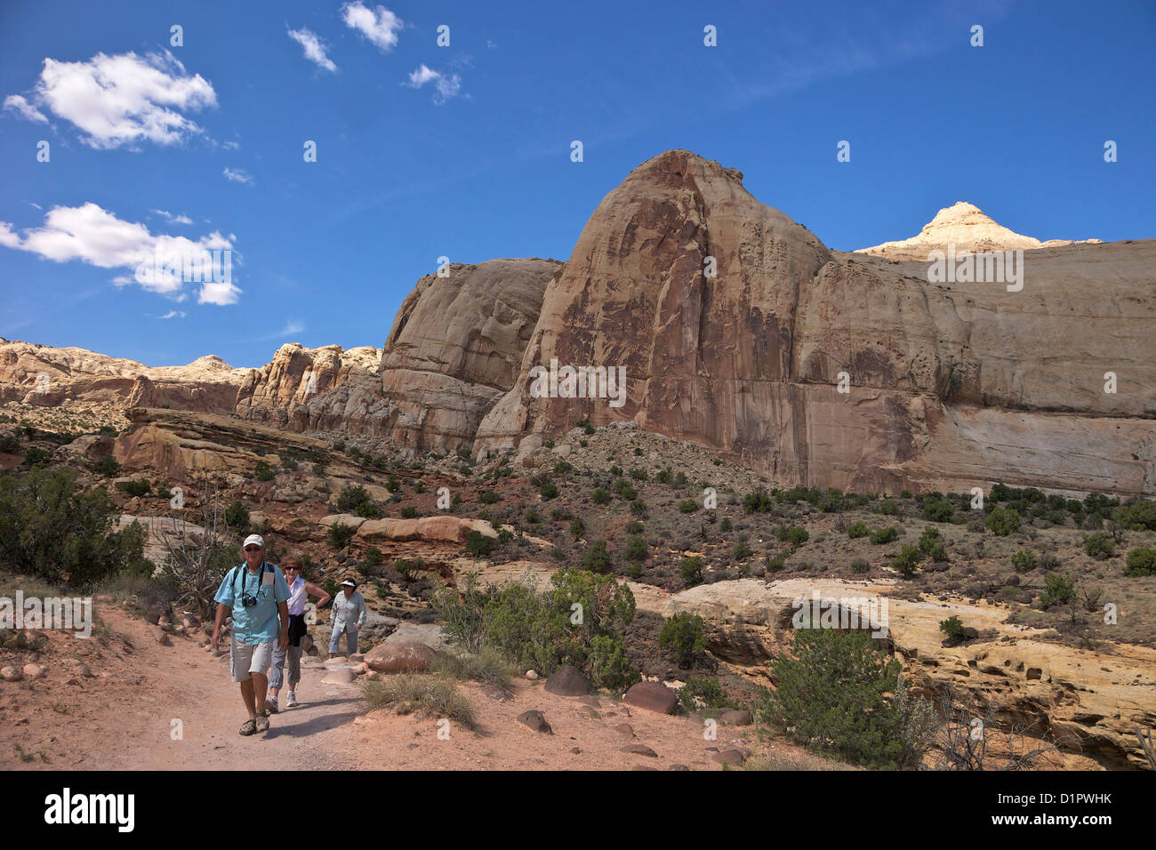 Tourists and visitors walking the Hickman Bridge Trail, Navajo Dome ...