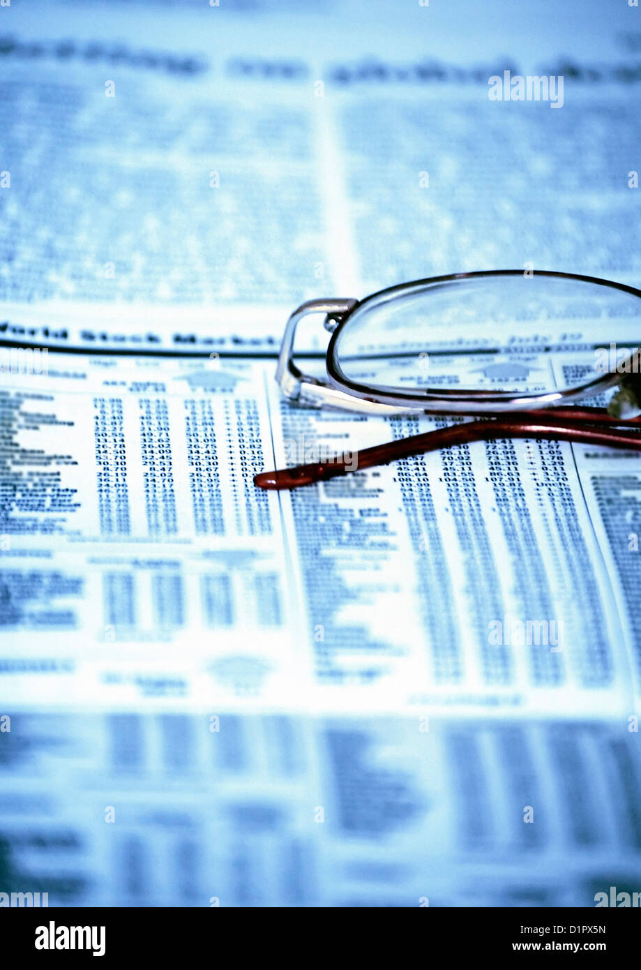 financial newspaper and reading glasses Stock Photo - Alamy