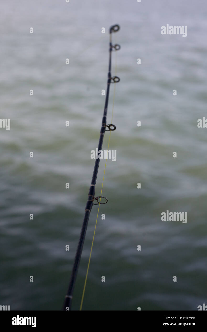 Sea Fishing rod and line above the water from boat Stock Photo - Alamy