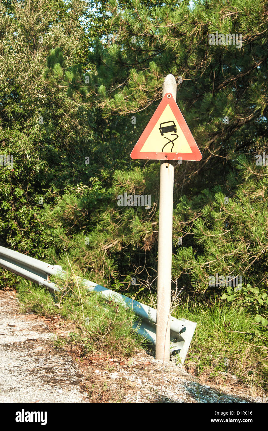 Danger Road Sign - Driving in mountains Stock Photo - Alamy