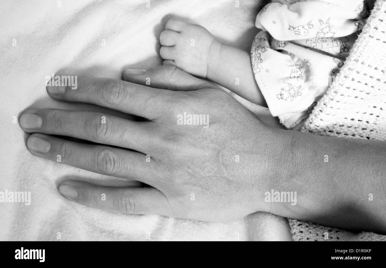 The image of hands of parents and the child Stock Photo - Alamy