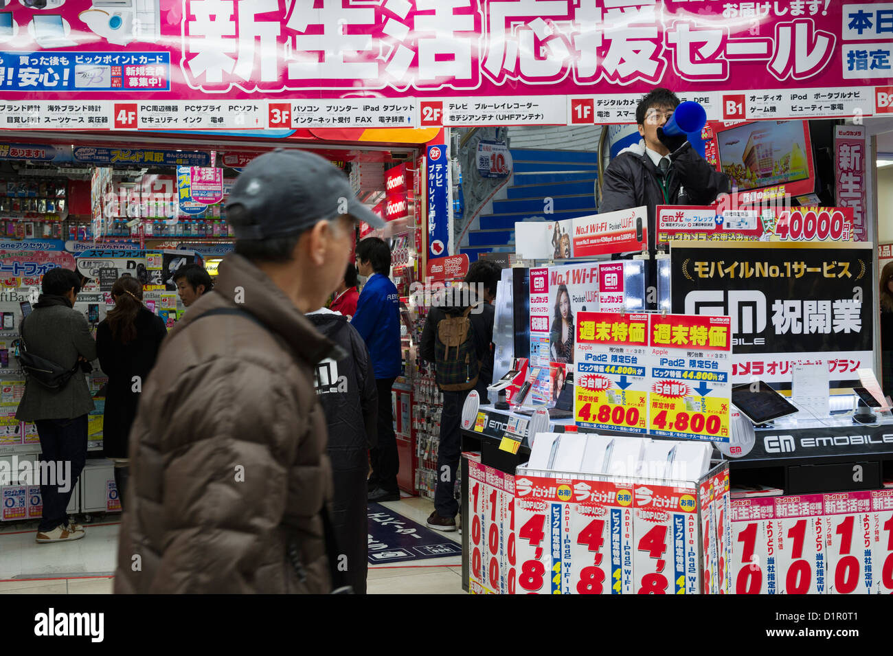 Japanese salesman using a cone megaphone in Shinjuku, Tokyo, Japan ...