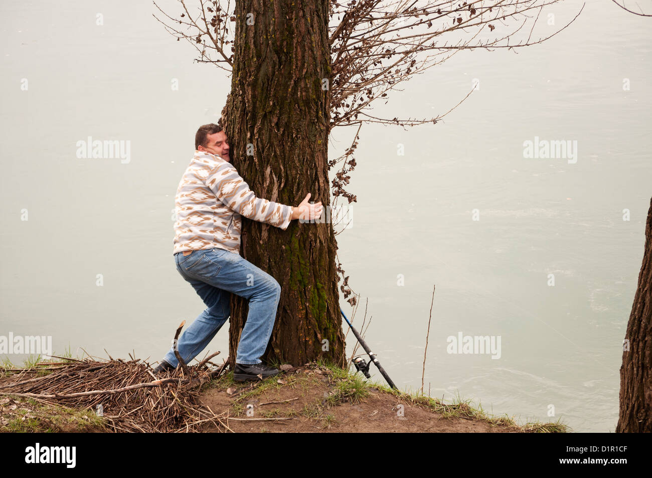 Hugging a tree Stock Photo - Alamy