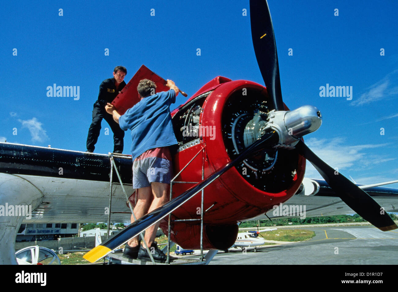Colombia, St Andres, Catalina PBY-5A hydroplane. Crew repairing motor ...