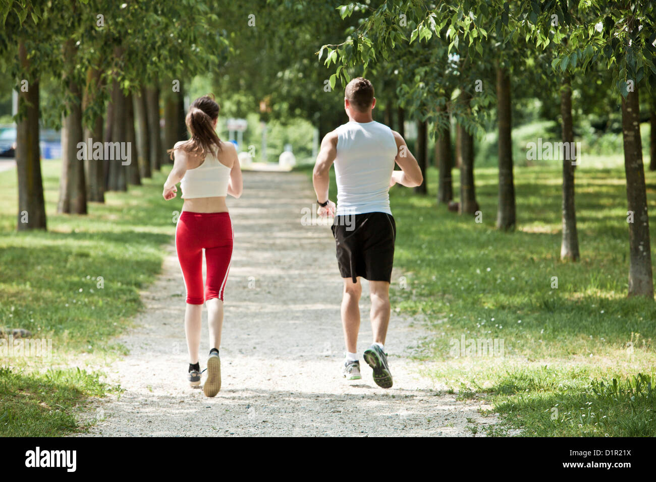 Couple jogging at the park Stock Photo - Alamy