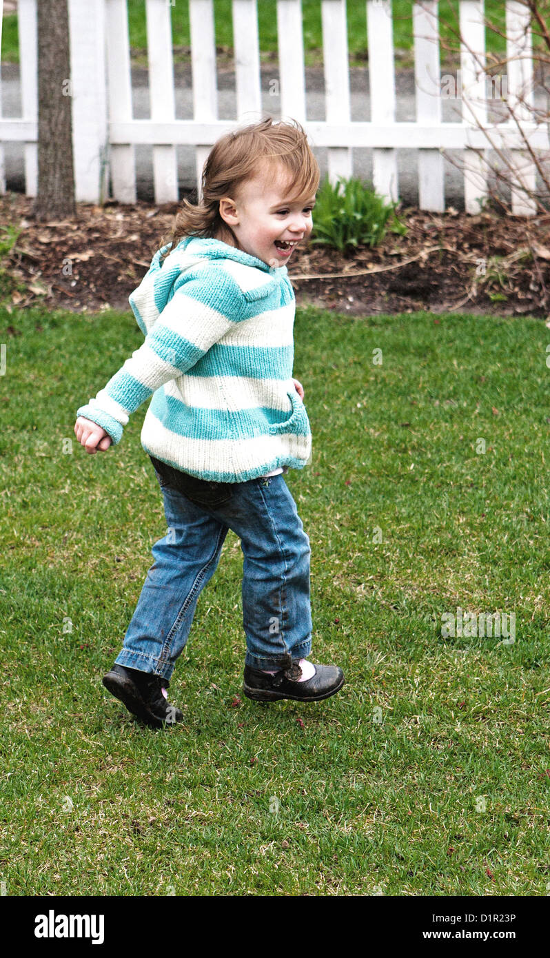 Happy toddler walking Stock Photo - Alamy