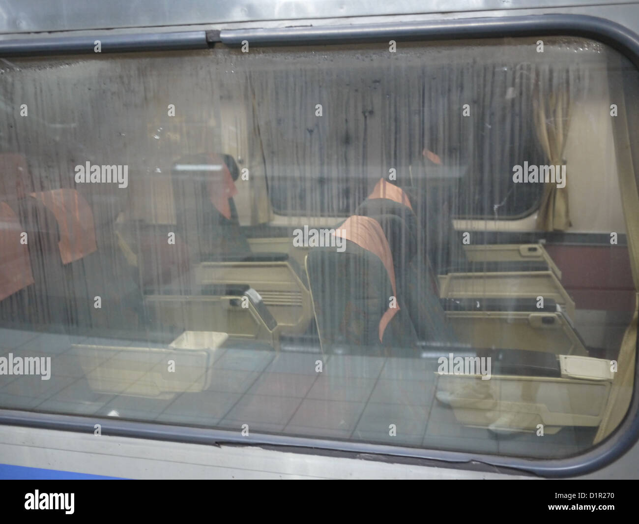 peeking into a train cabin through window Stock Photo - Alamy