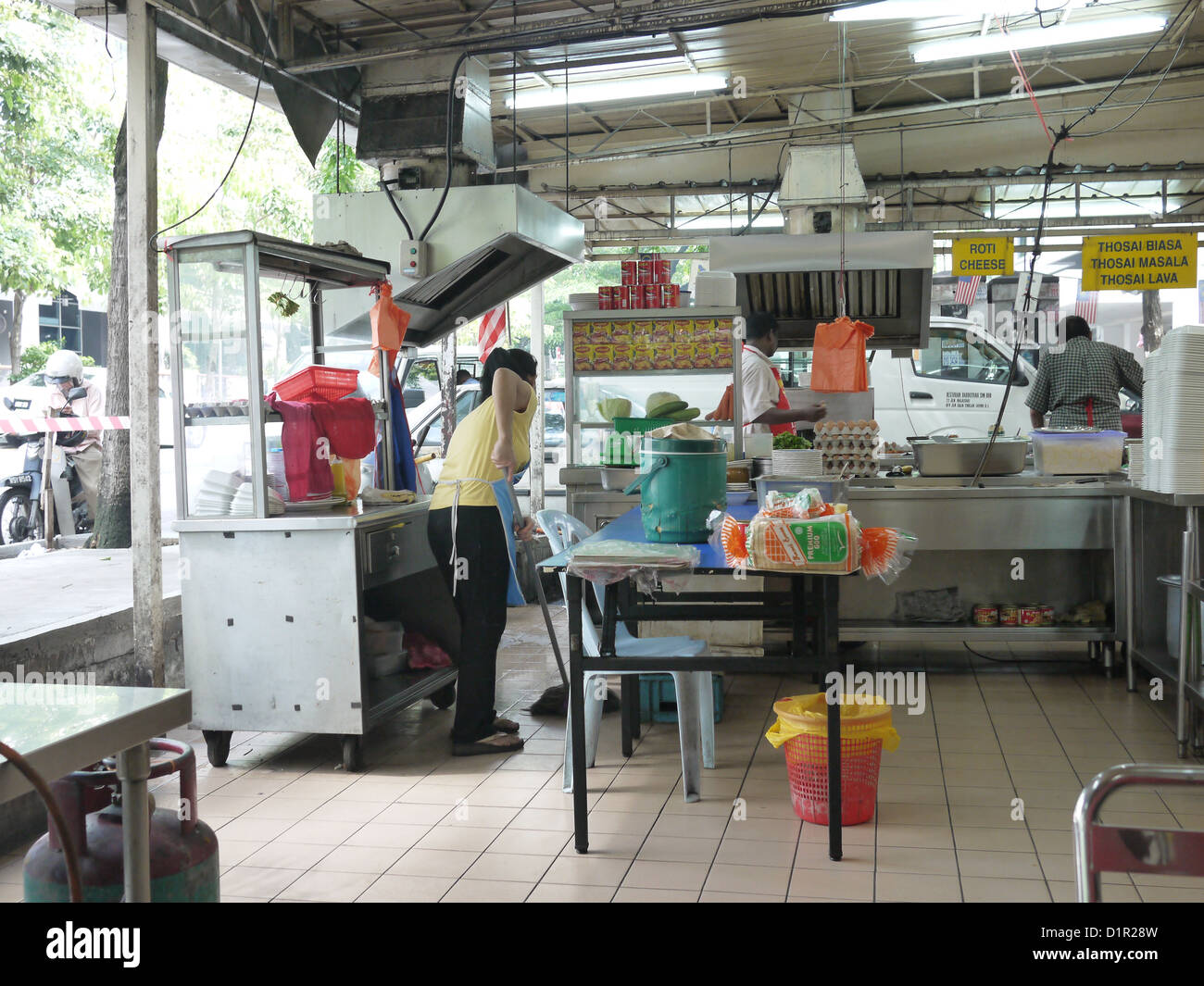 worker mopping floor restaurant kitchen Asia Stock Photo - Alamy