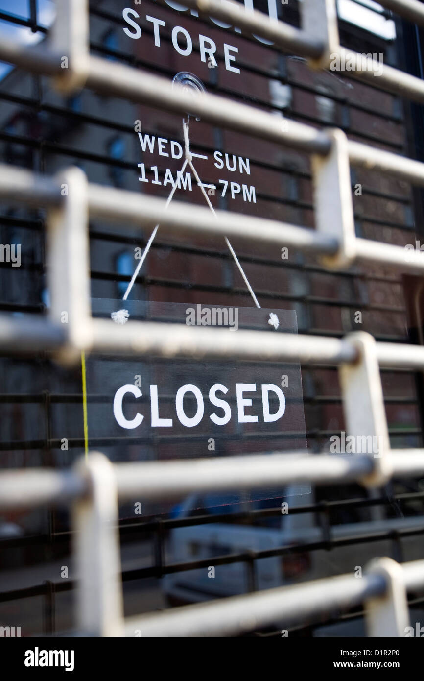 Closed sign in shop window Stock Photo - Alamy