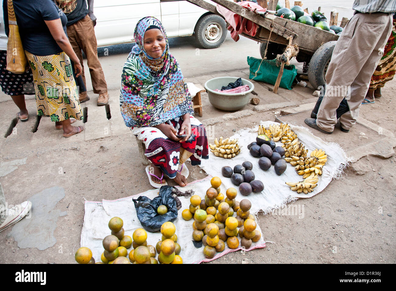Africa;Tanzania;Moshi; Muslin woman selling in outdoor fruit and ...
