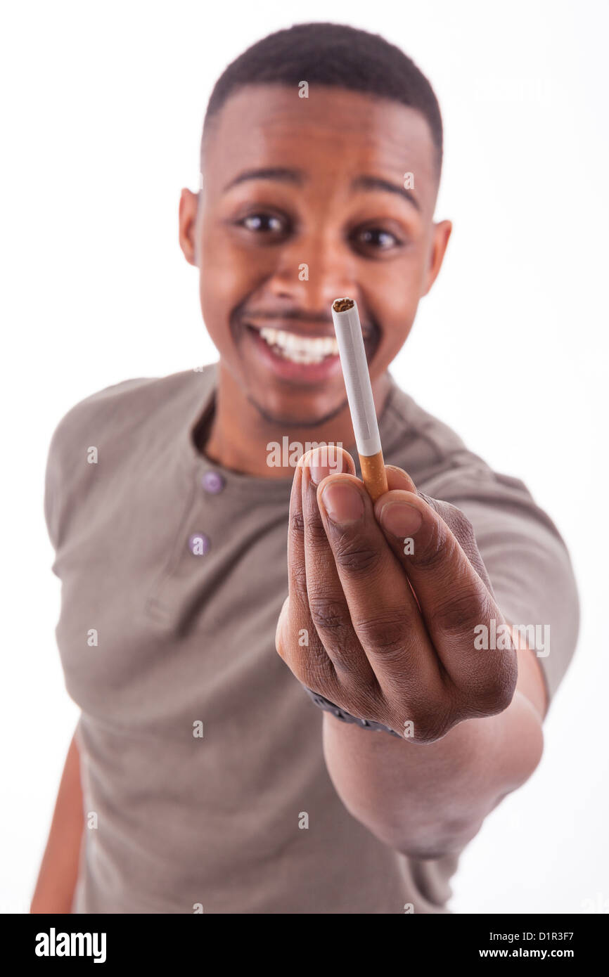 Young african american man offering a cigarette, isolated on white ...