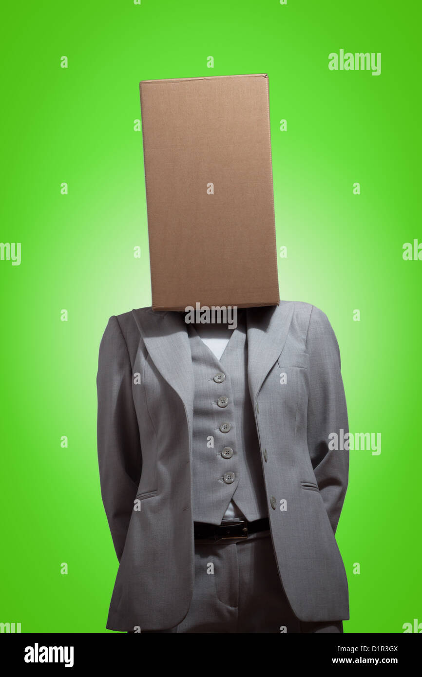 Business woman with a cardboard box head on a green background Stock ...