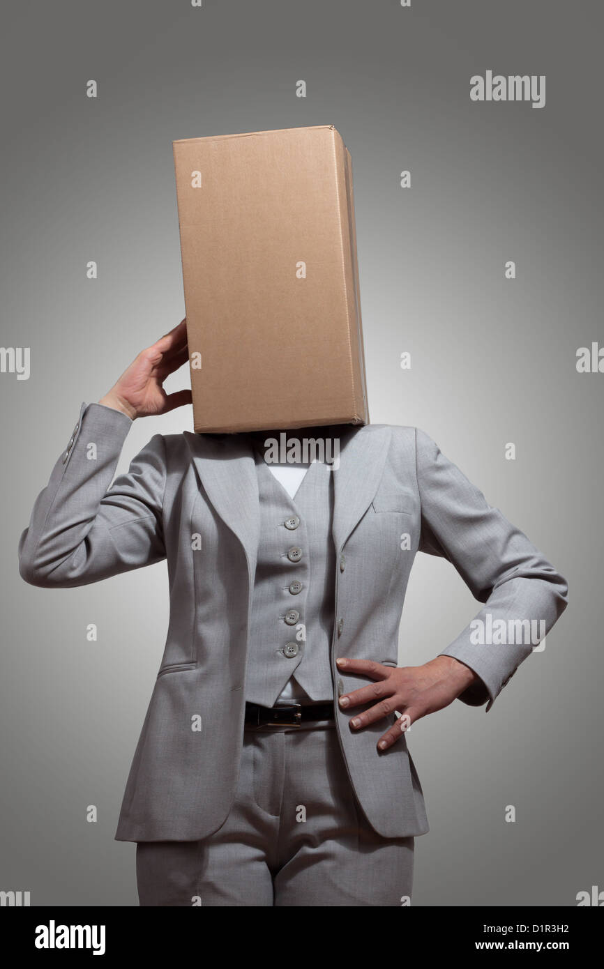 Business woman with a cardboard box head on a gray background Stock ...