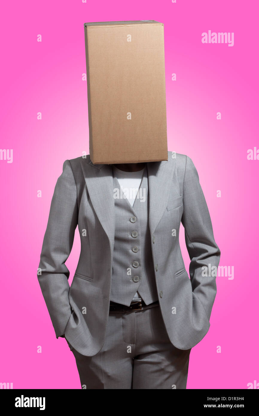Business woman with a cardboard box head on a magenta background Stock ...