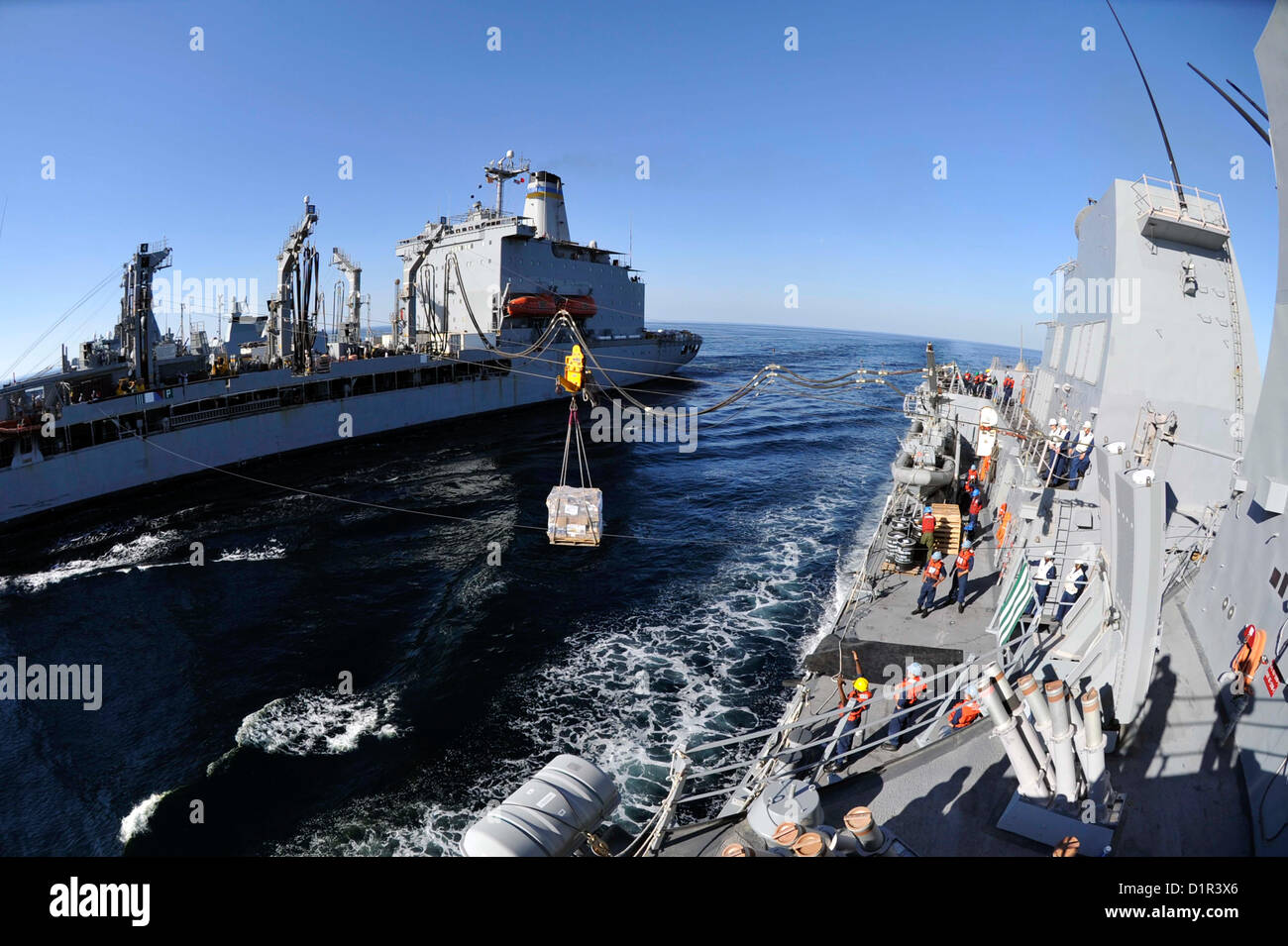 The guided-missile destroyer USS Jason Dunham (DDG 109) and the ...