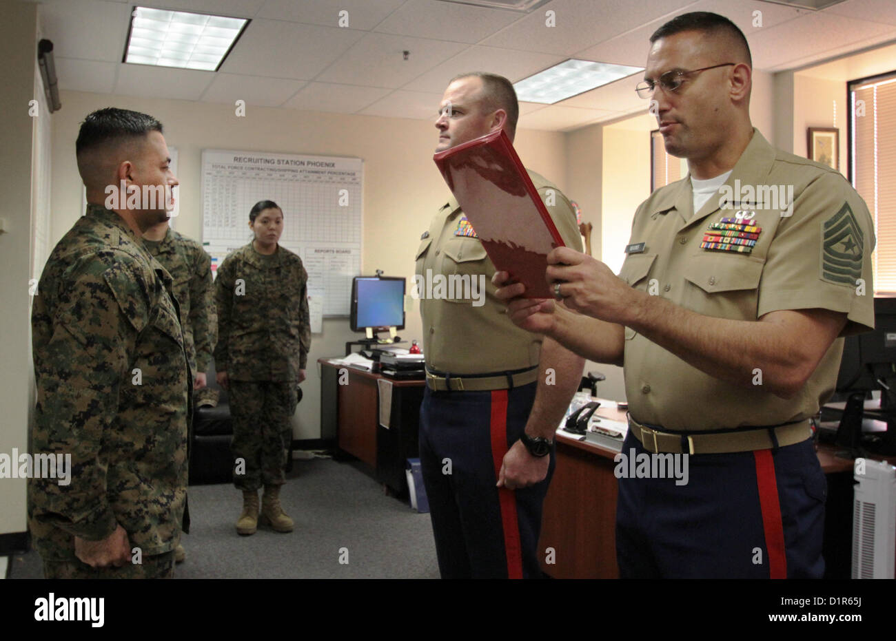 Sgt. Maj. reads a promotion warrant for Staff Sgt. Roque Palmerinvega ...