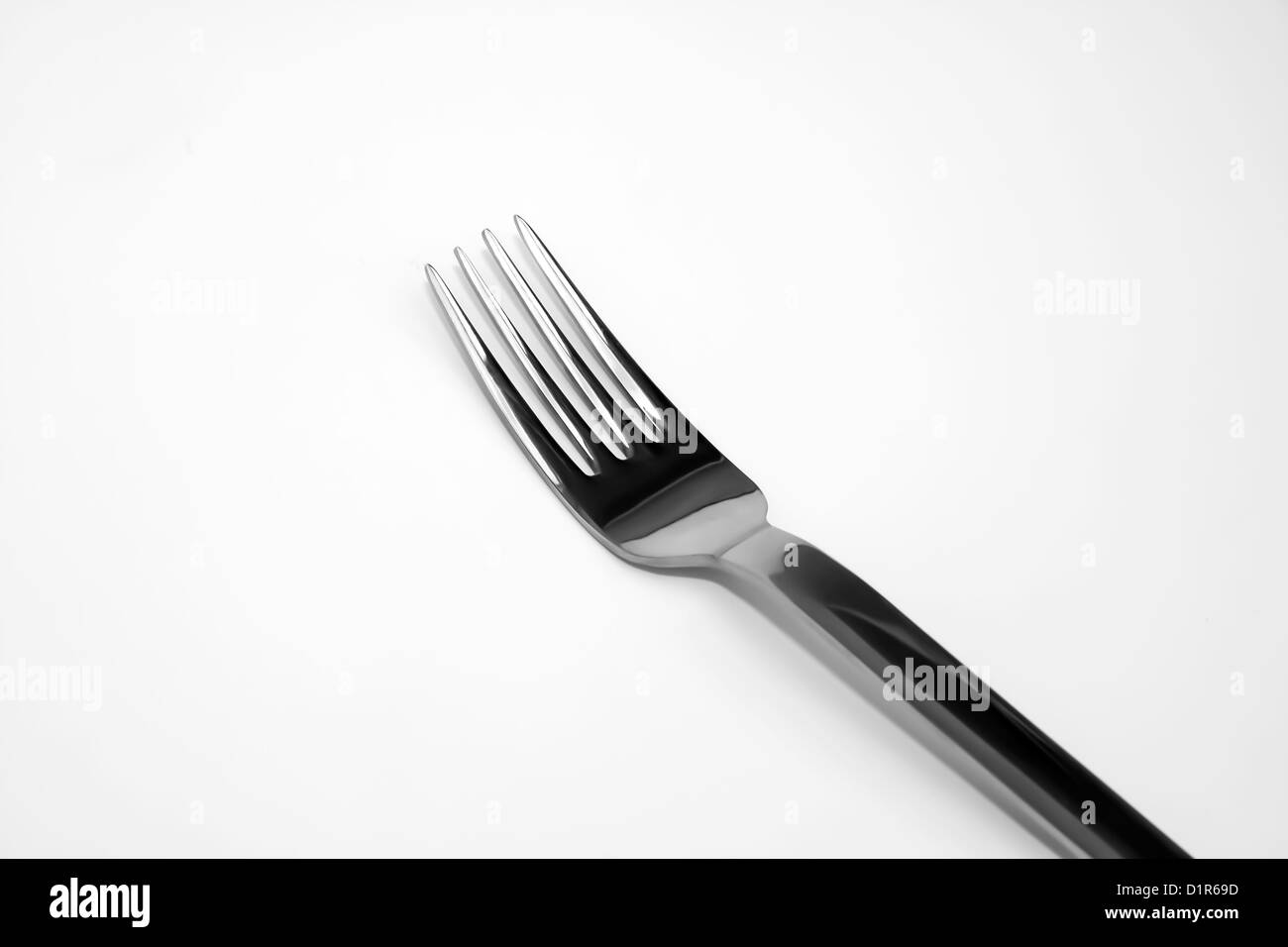 Shiny chrome fork over white background Stock Photo - Alamy