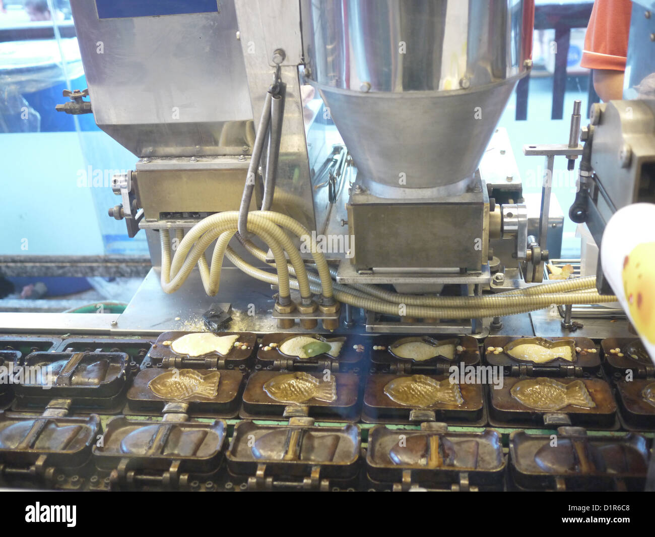 machine making fish shape snack Stock Photo - Alamy
