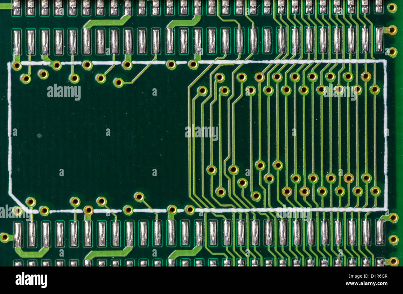 A closeup of a printed circuit board with silver traces Stock Photo - Alamy