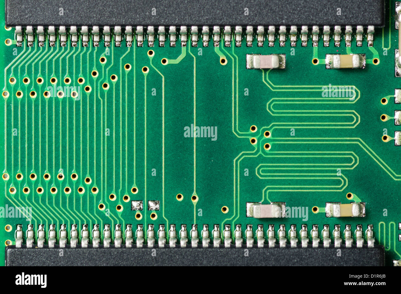 A closeup of a printed circuit board with silver solder points Stock ...