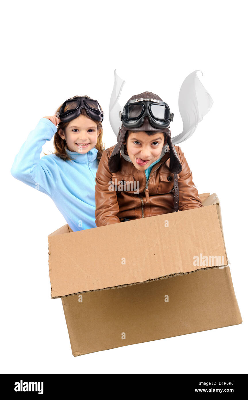 Young couple pilot flying a cardboard box isolated in white Stock Photo ...