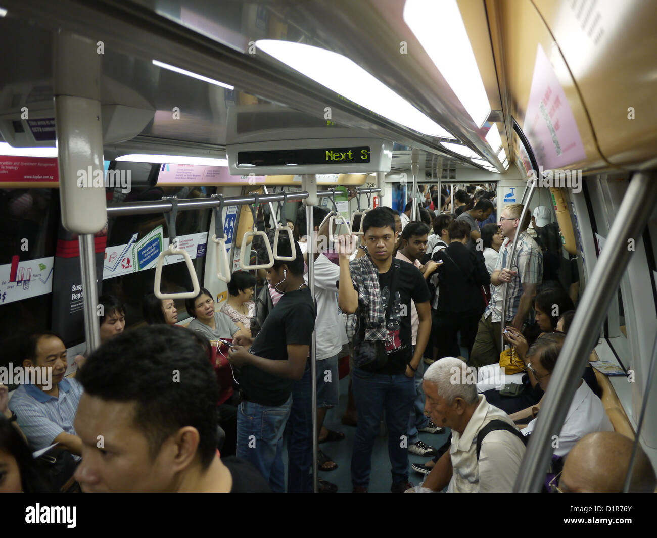 busy train cabin inside singapore mrt Stock Photo - Alamy