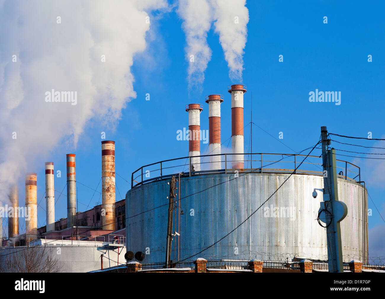 Lots of smoking chimneys other blue sky Stock Photo - Alamy