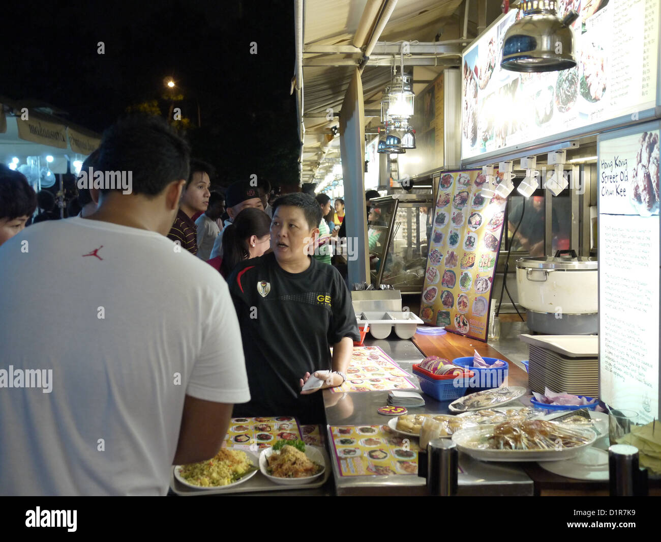 Singapore food stall night Stock Photo - Alamy
