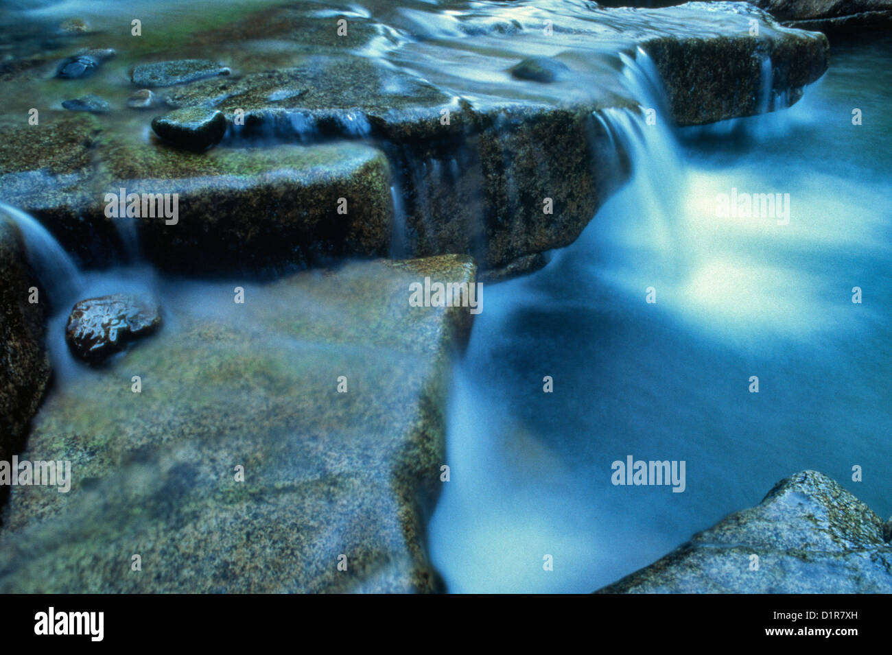 Water falling over rocks Stock Photo - Alamy