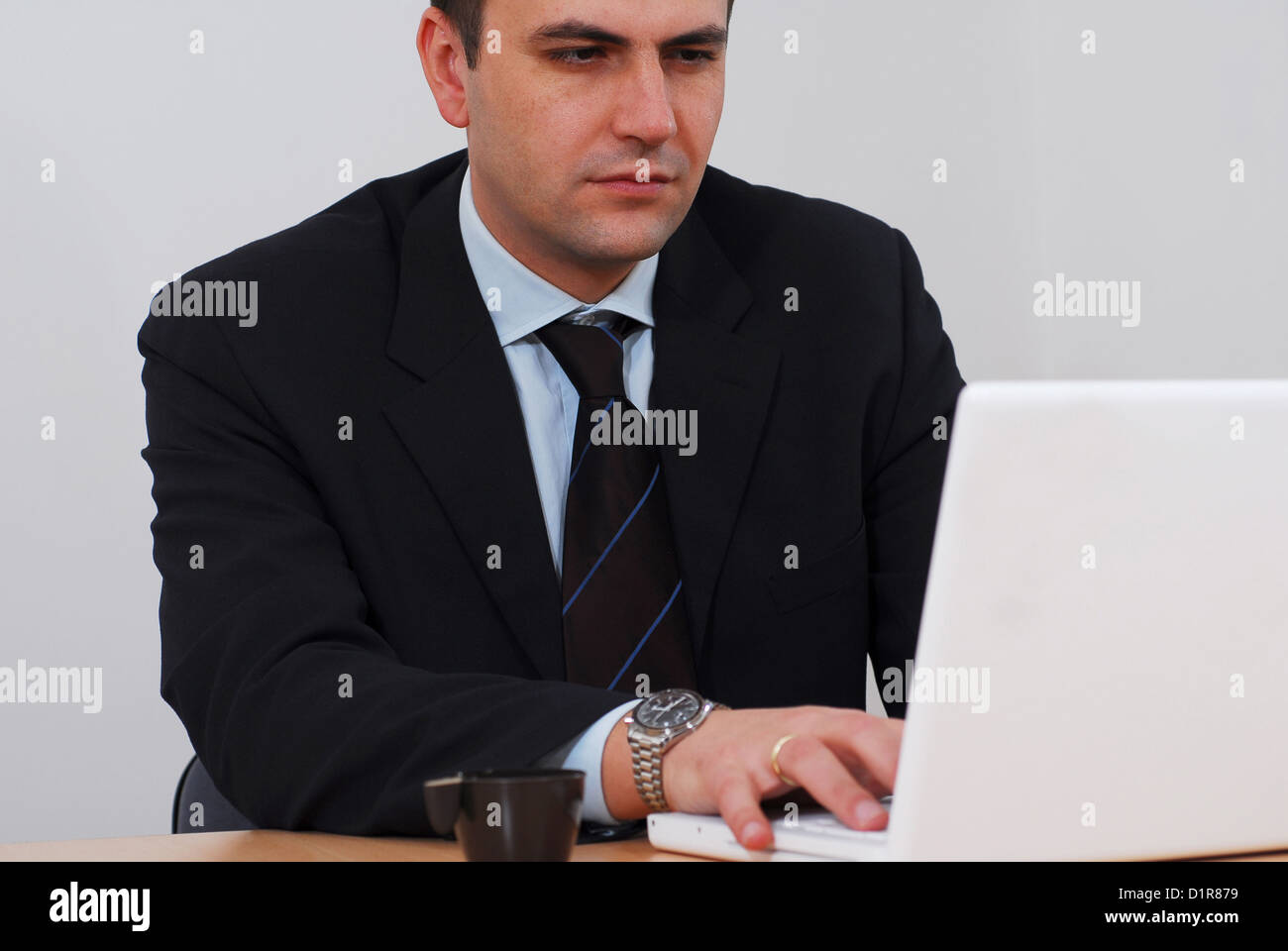 Young entrepreneur working on his computer Stock Photo - Alamy