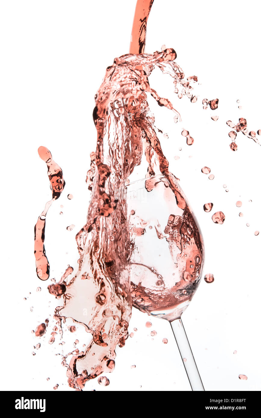 rose wine splashing on white background Stock Photo - Alamy