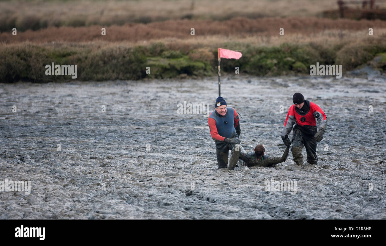 Competitors struggle through the thick mud during the annual Maldon Mud ...