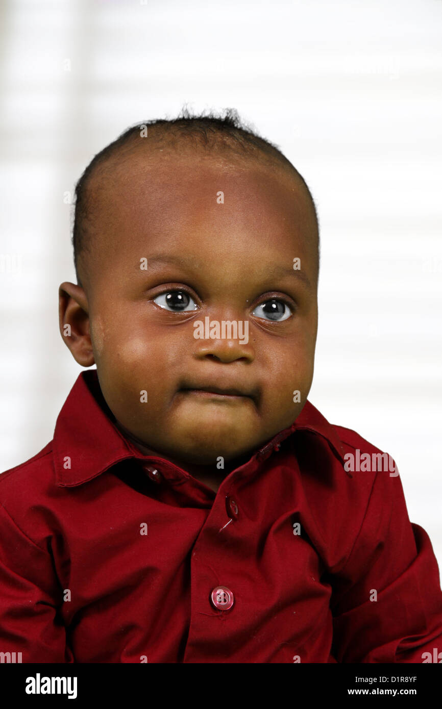 Portrait of a boy who is inside his home Stock Photo - Alamy