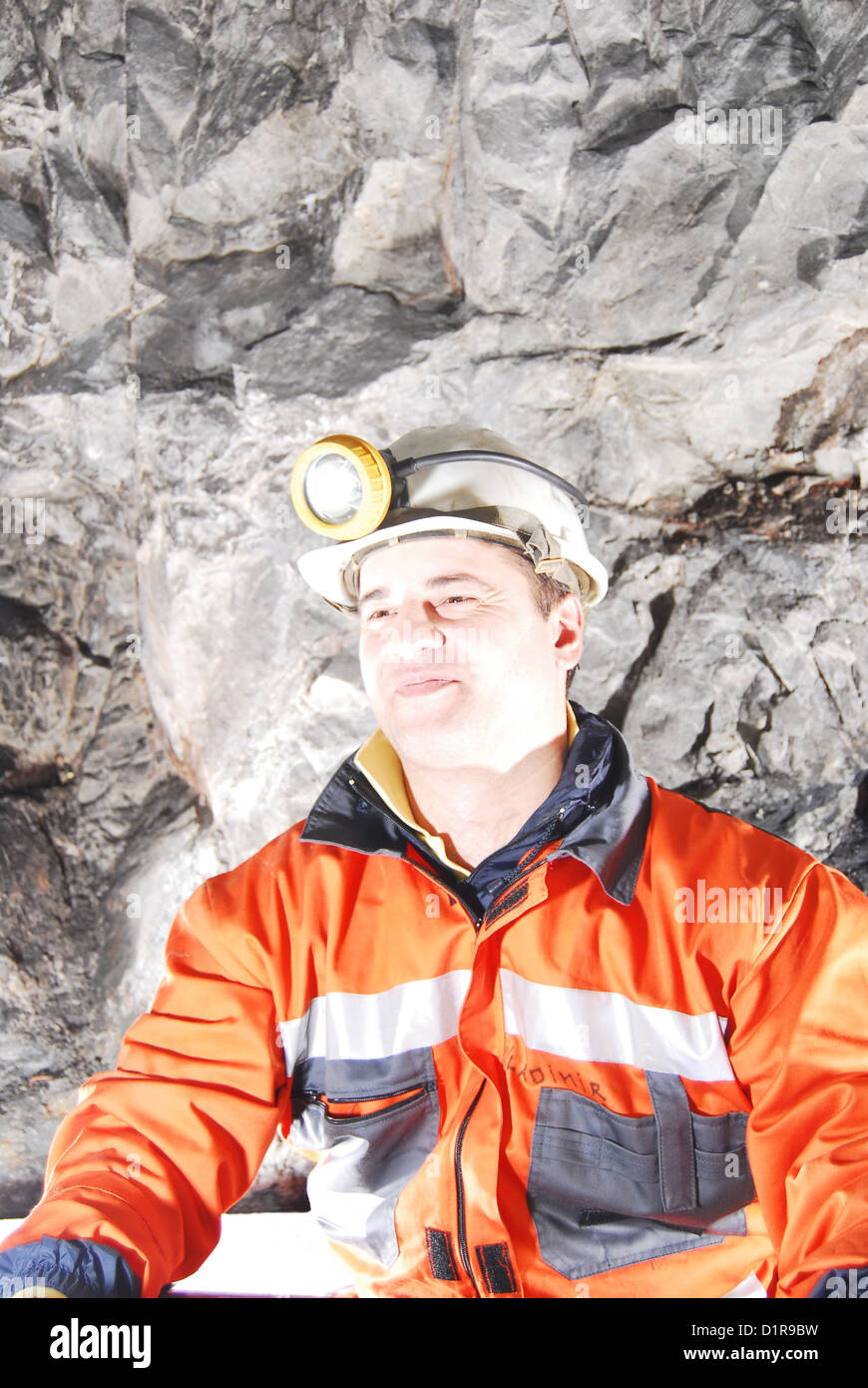 Happy miner in a mine shaft stock photo Stock Photo - Alamy