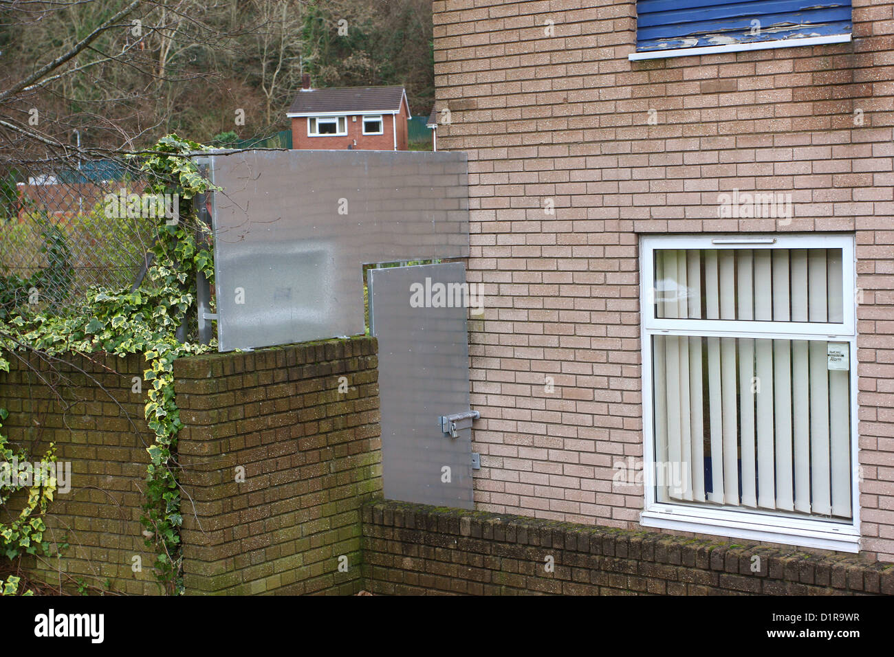 Unclimbable secure gate on the side of a young offenders rehabilitation ...