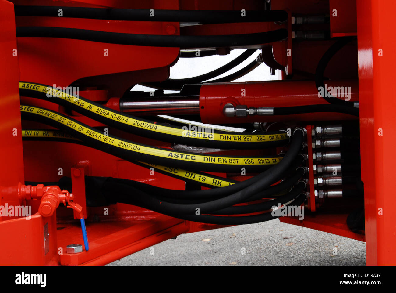 New heavy duty machine pressure pipes Stock Photo - Alamy