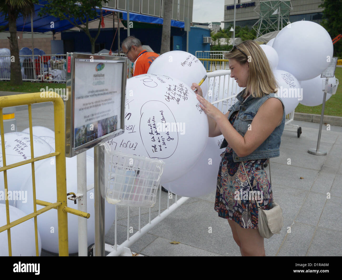 woman signing white balloon Stock Photo - Alamy