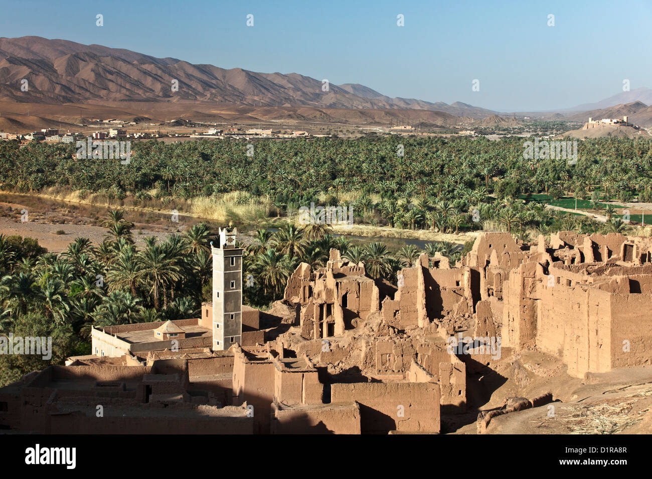 Morocco, near Agdz, Village, kasbah and oasis with date palm trees ...