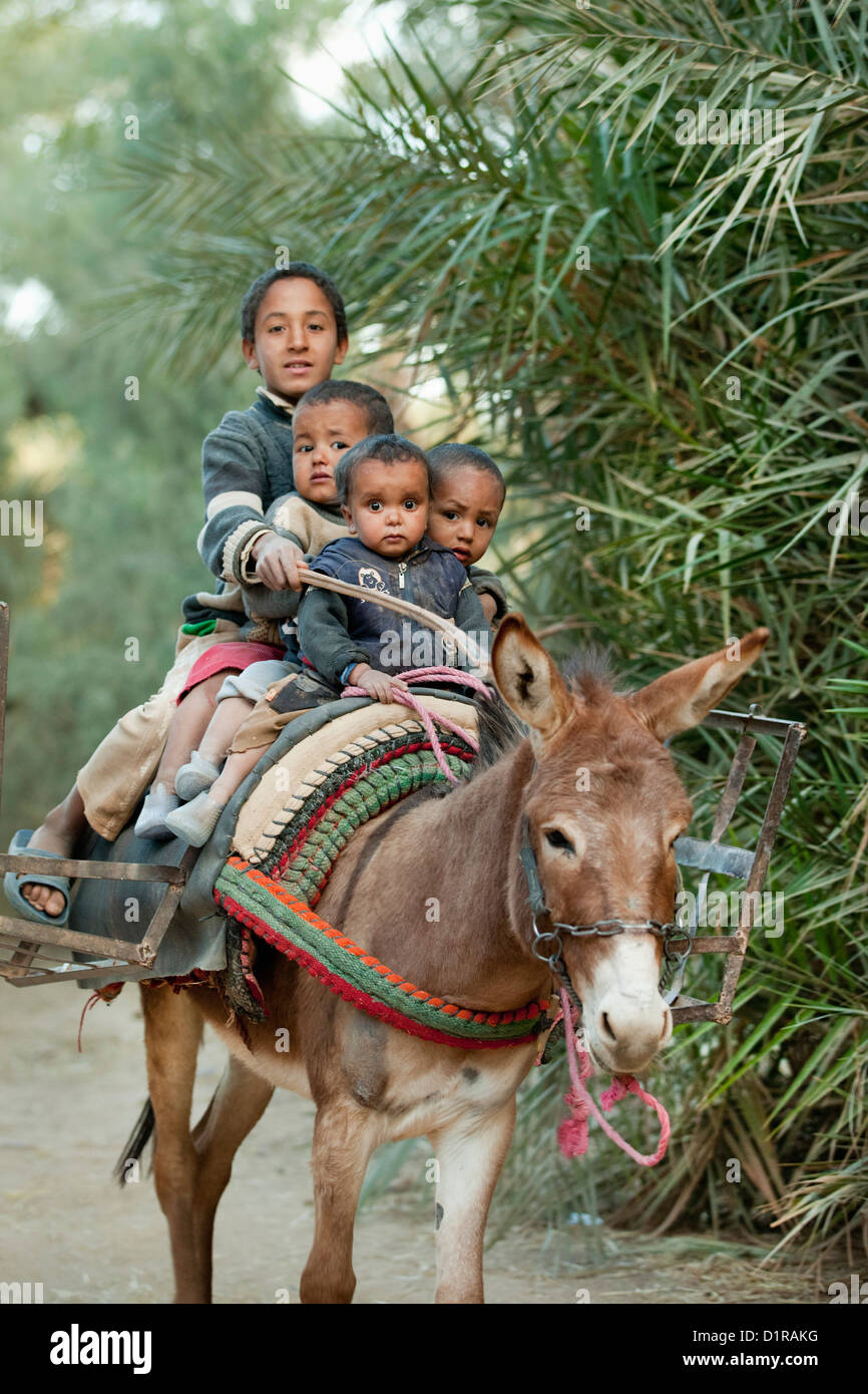 Children riding donkey hi-res stock photography and images - Alamy
