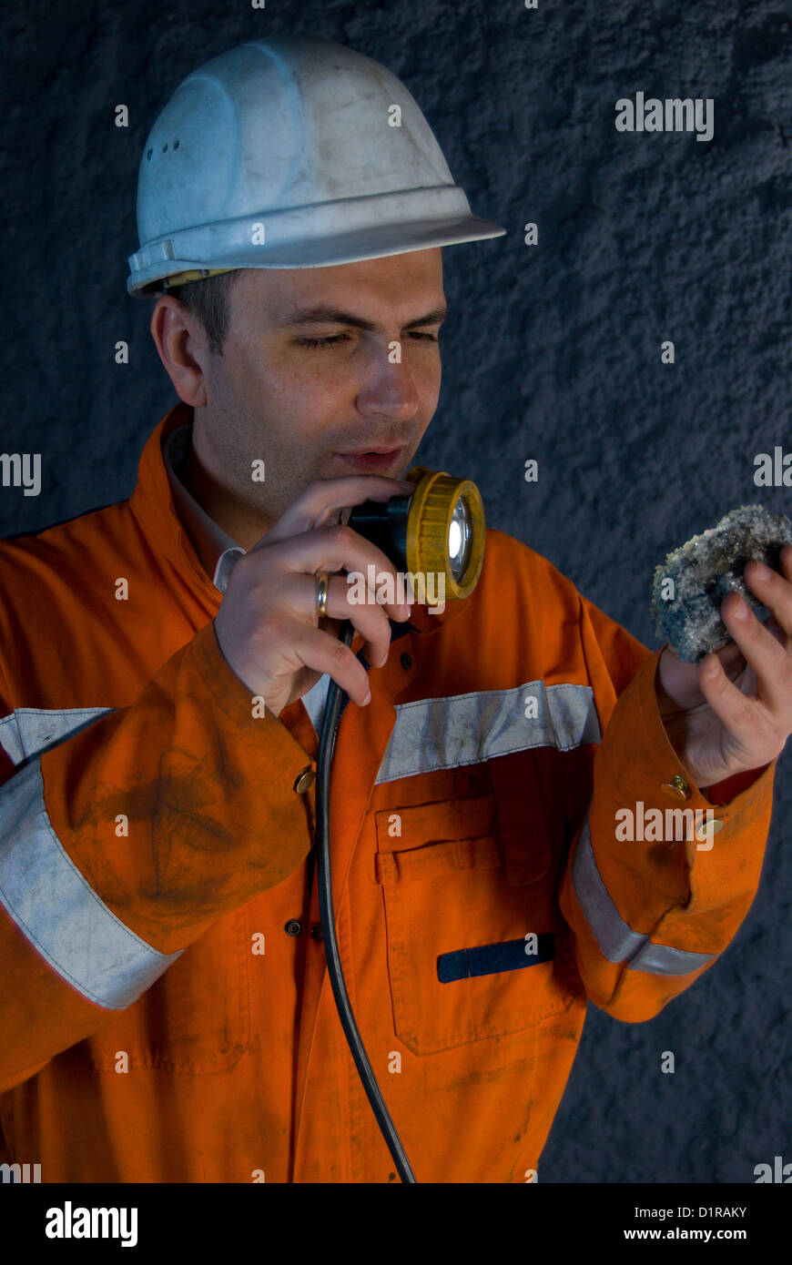 Engineer inspecting the rock mineral stock photo Stock Photo - Alamy