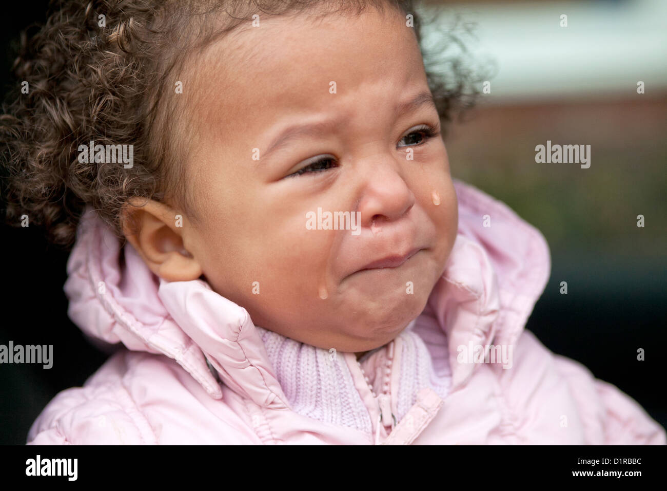 portrait of a young mixed race toddler girl crying big tears Stock ...