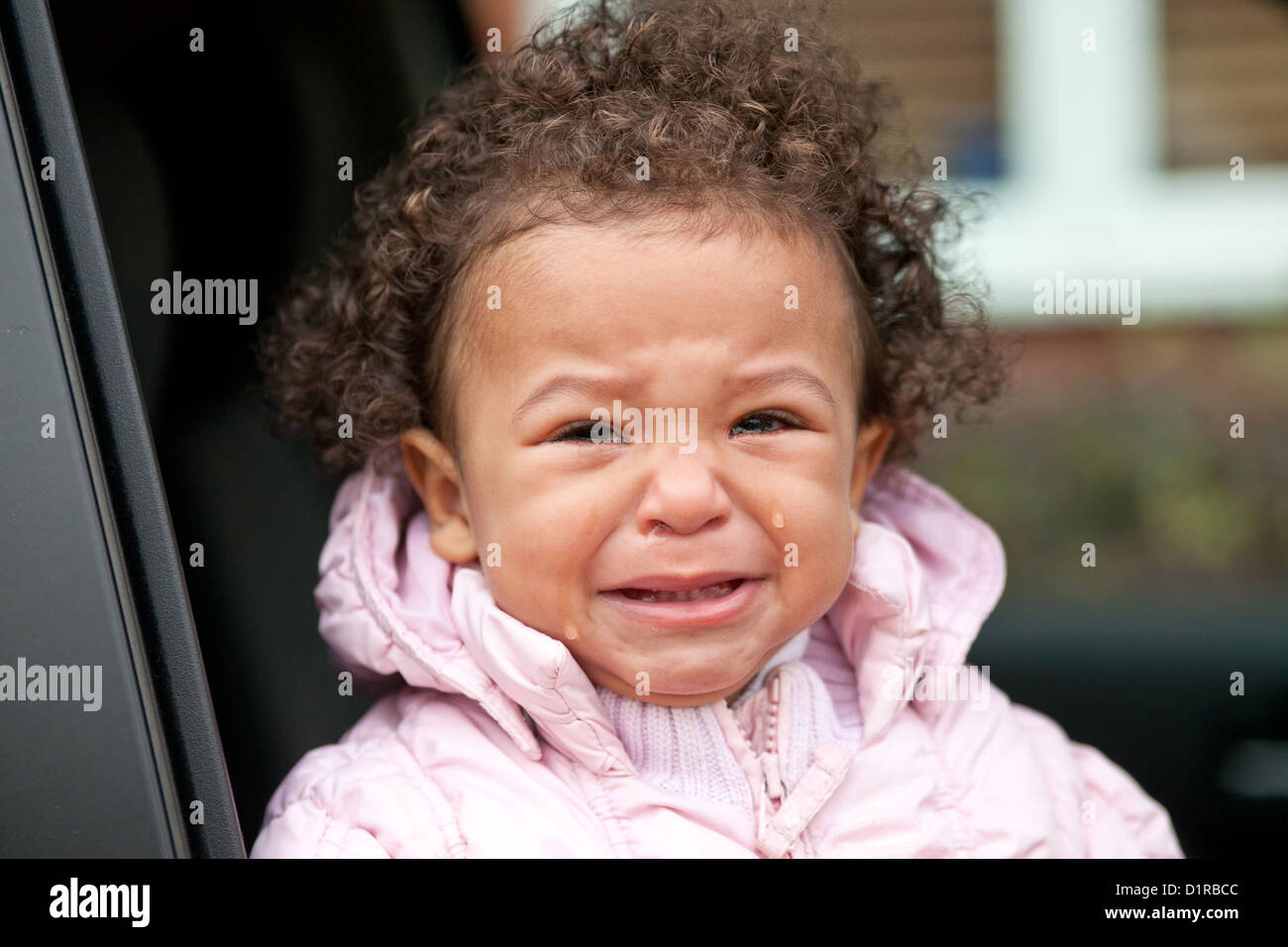 portrait of a young mixed race toddler girl crying big tears Stock ...