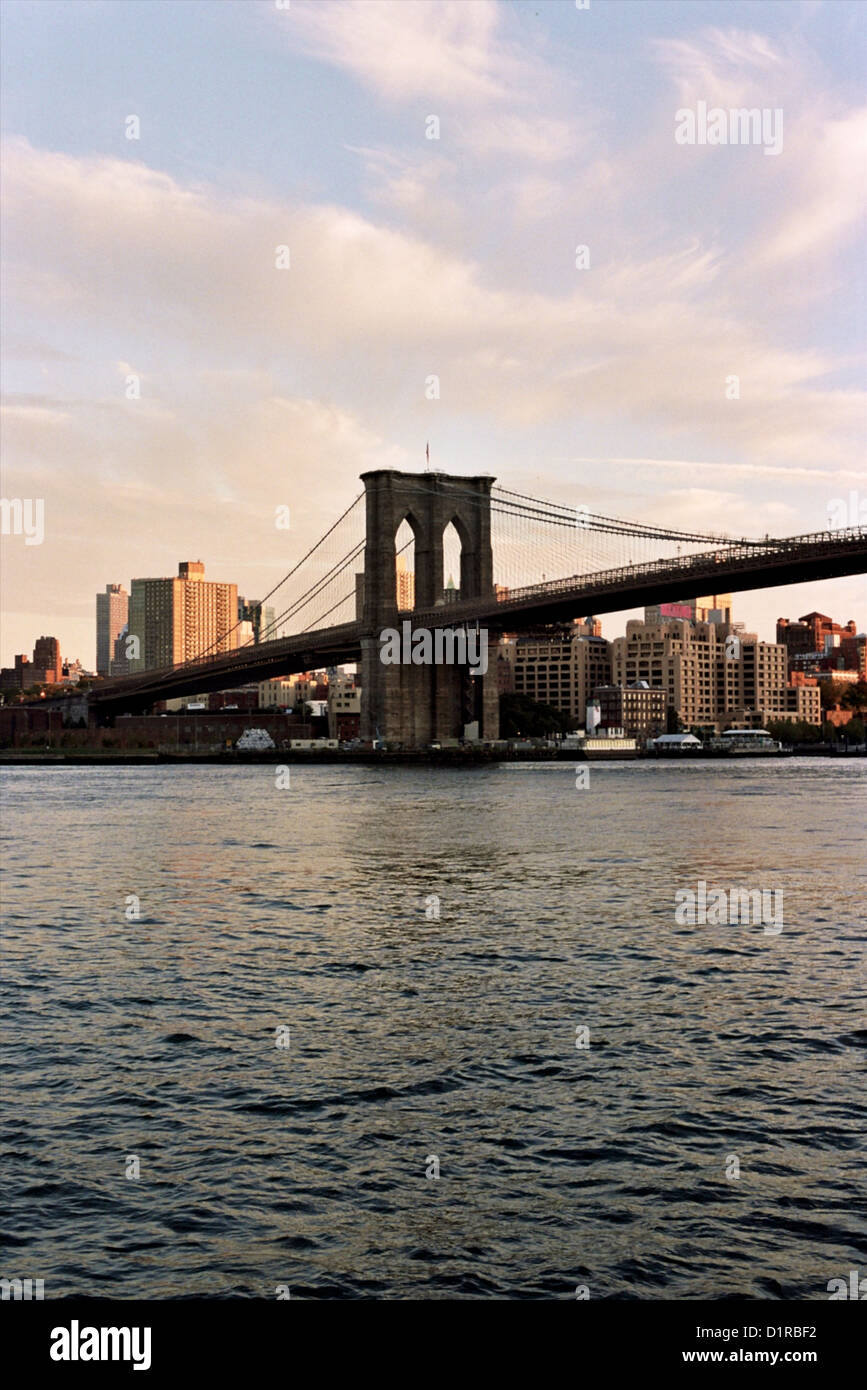 The Brooklyn Bridge rises before the Brooklyn skyline, seen from Lower ...